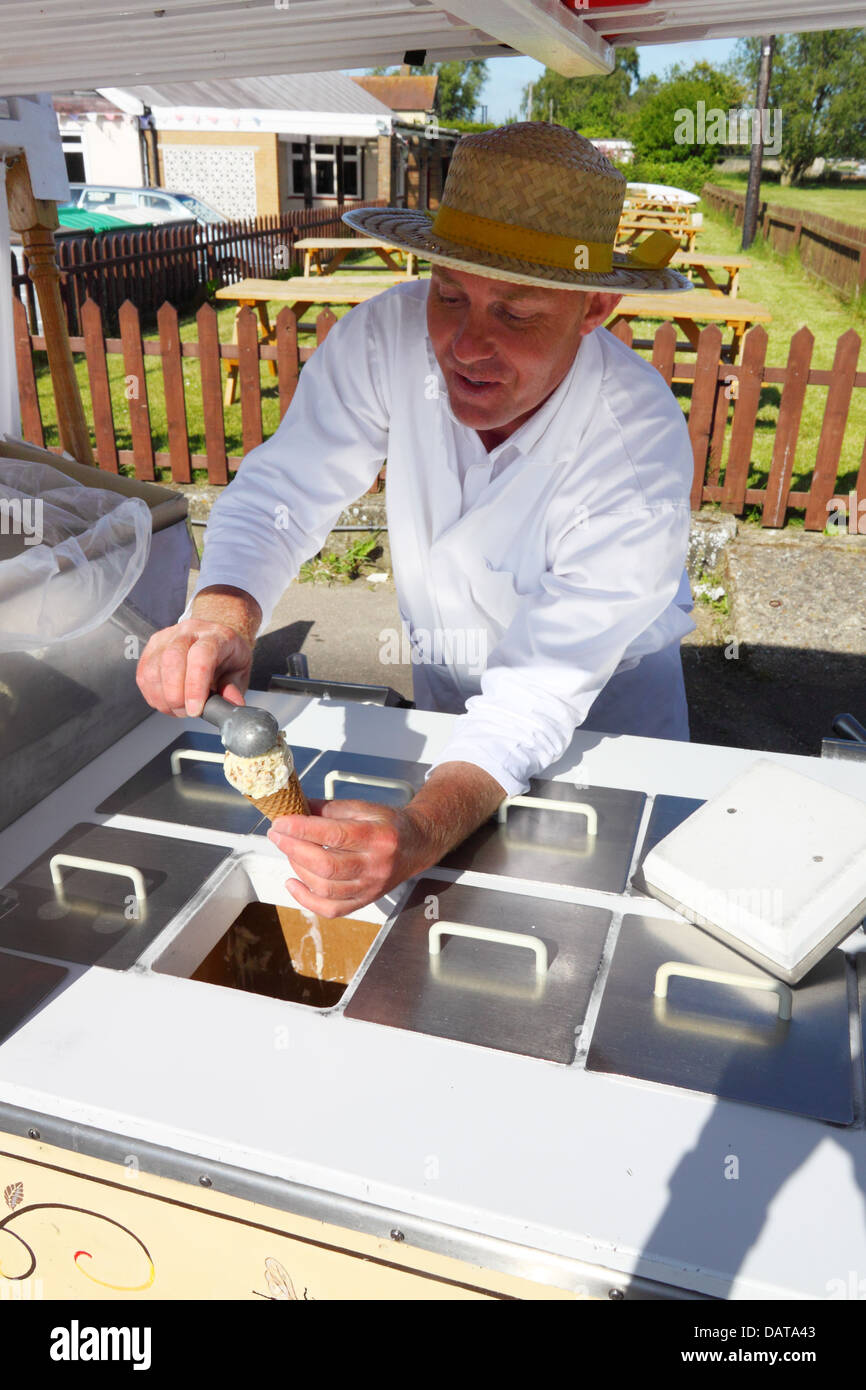 Ice cream vendor serving local Norfolk ice cream from a cart in in ...