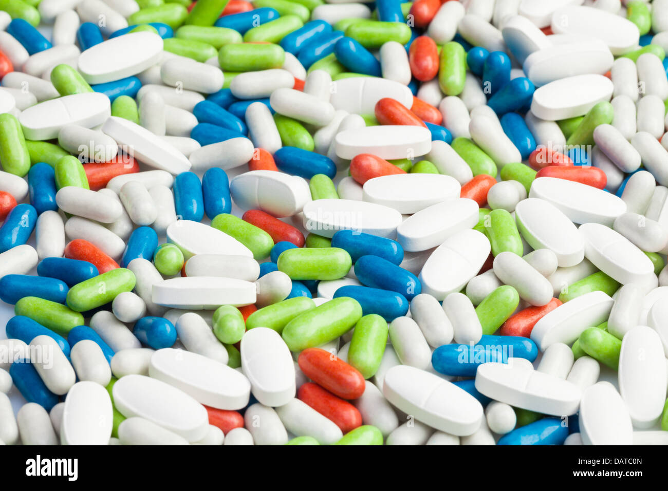 Many different drugs pills and tablets in different colors and shapes ...