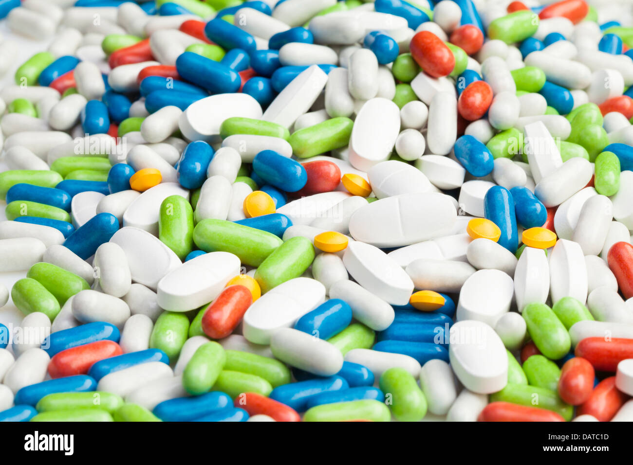 Pile of drugs, many different pills and tablets of different color blue ...