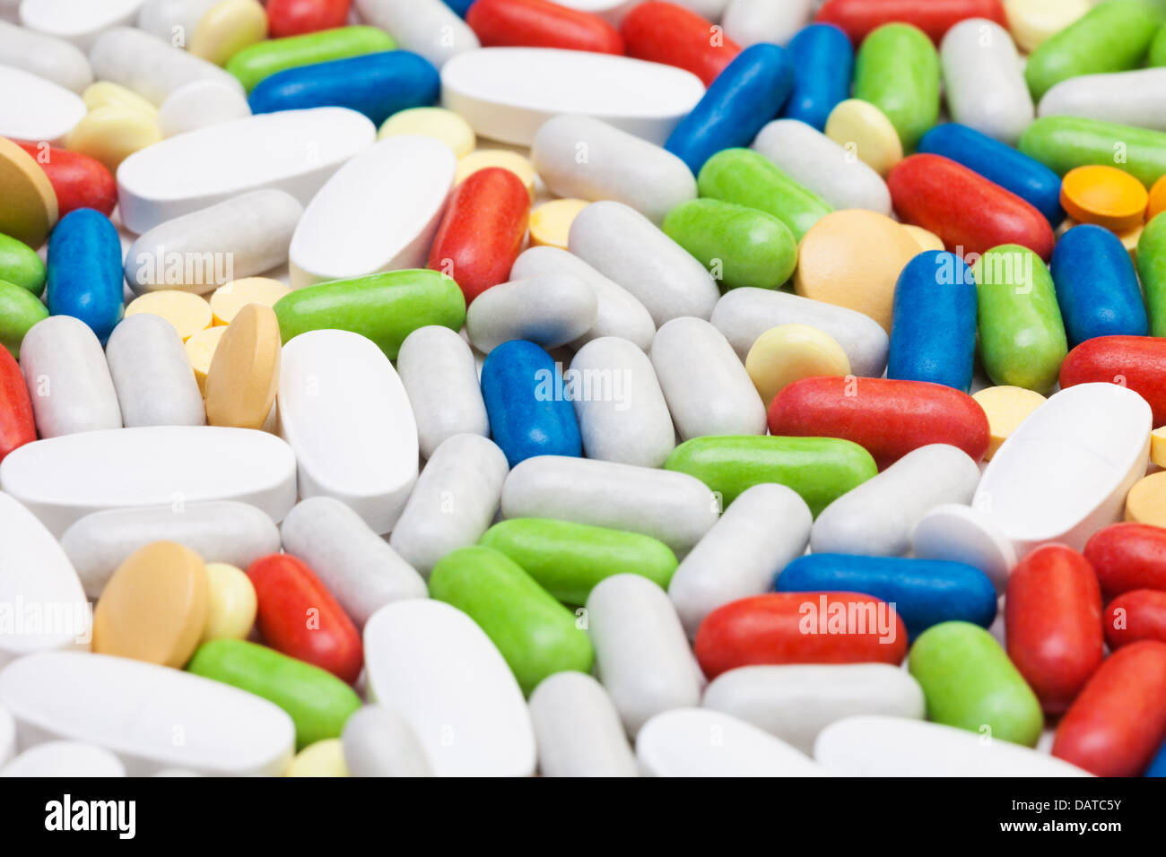 Pile of many different pills and tablets of different colors Stock ...