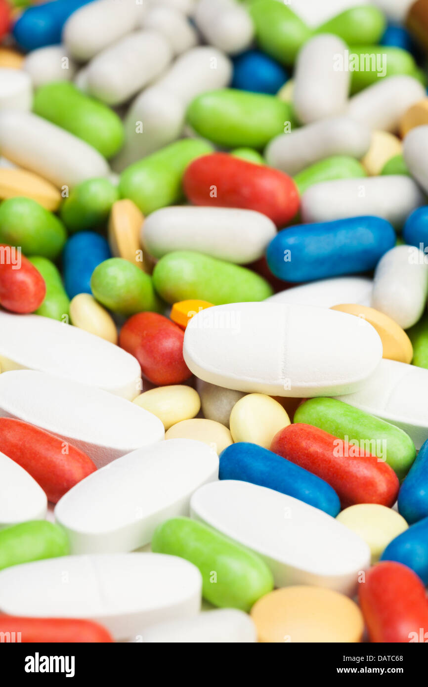 Large groups of many different pills and tablets drugs of different ...