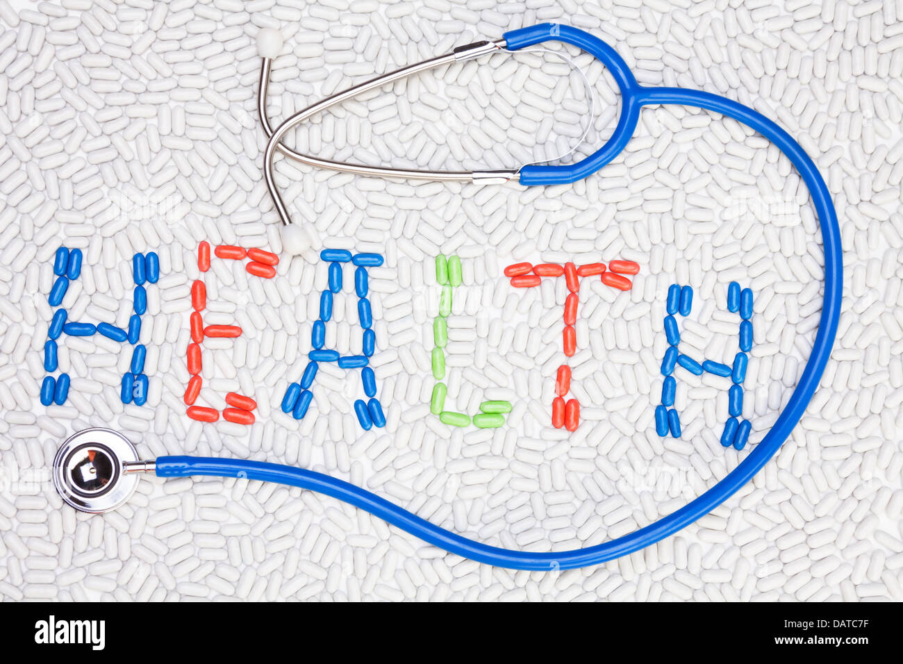 Health word text made of tablets and pills drugs of different colors ...