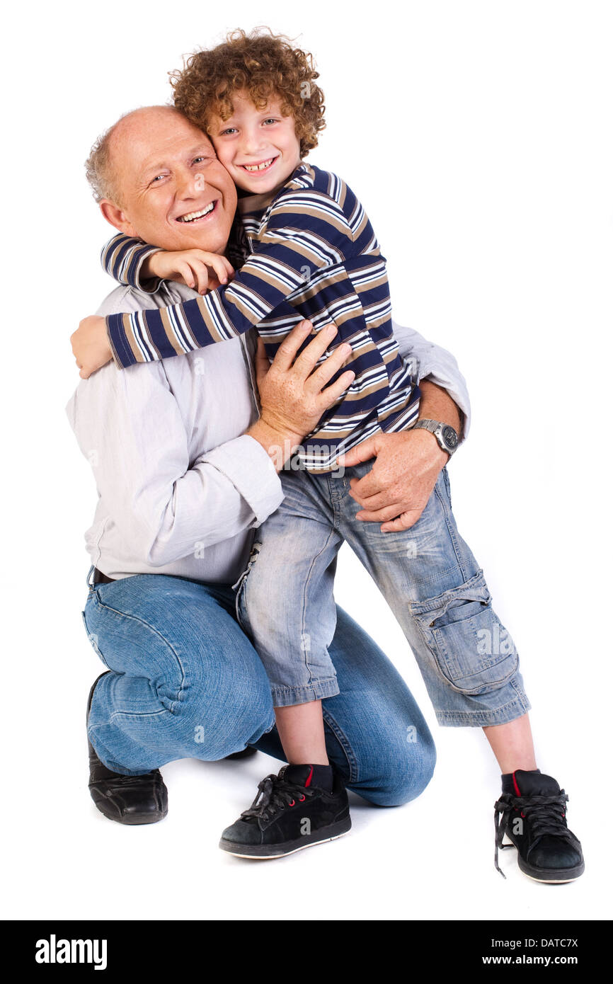 Grandson hugging his grandpa, indoors Stock Photo - Alamy