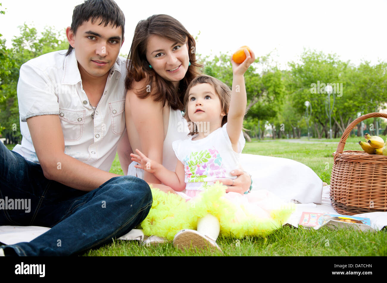 The family has a rest in park Stock Photo - Alamy