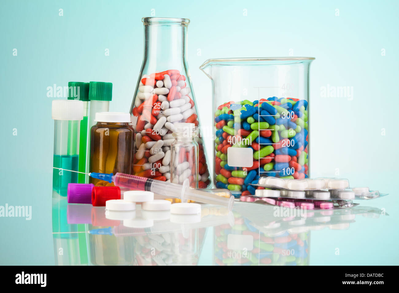 Many different drugs in pills, tablets and syringe in packages and ...