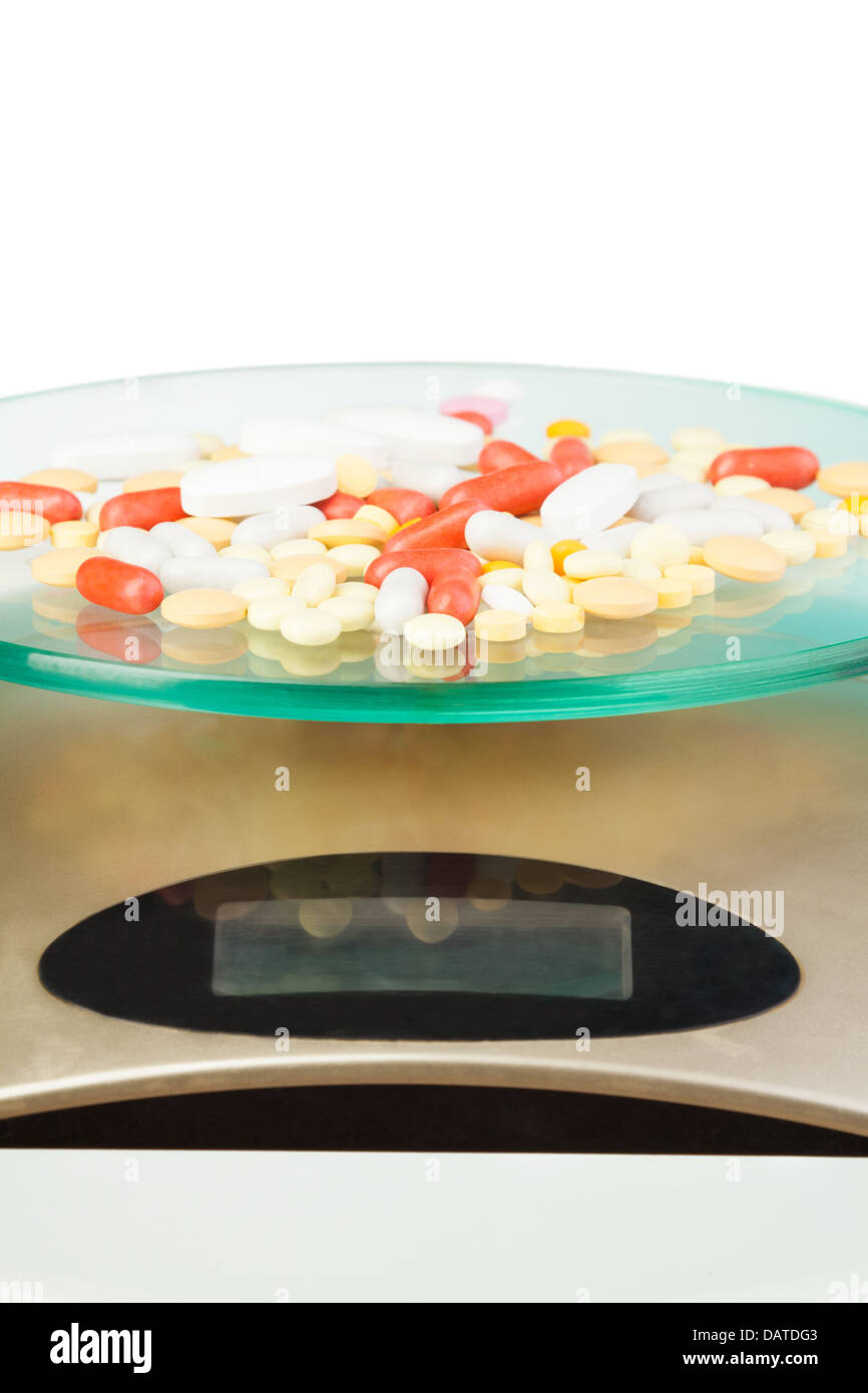 Close-up of scale with precious drugs on weights, isolated on white ...