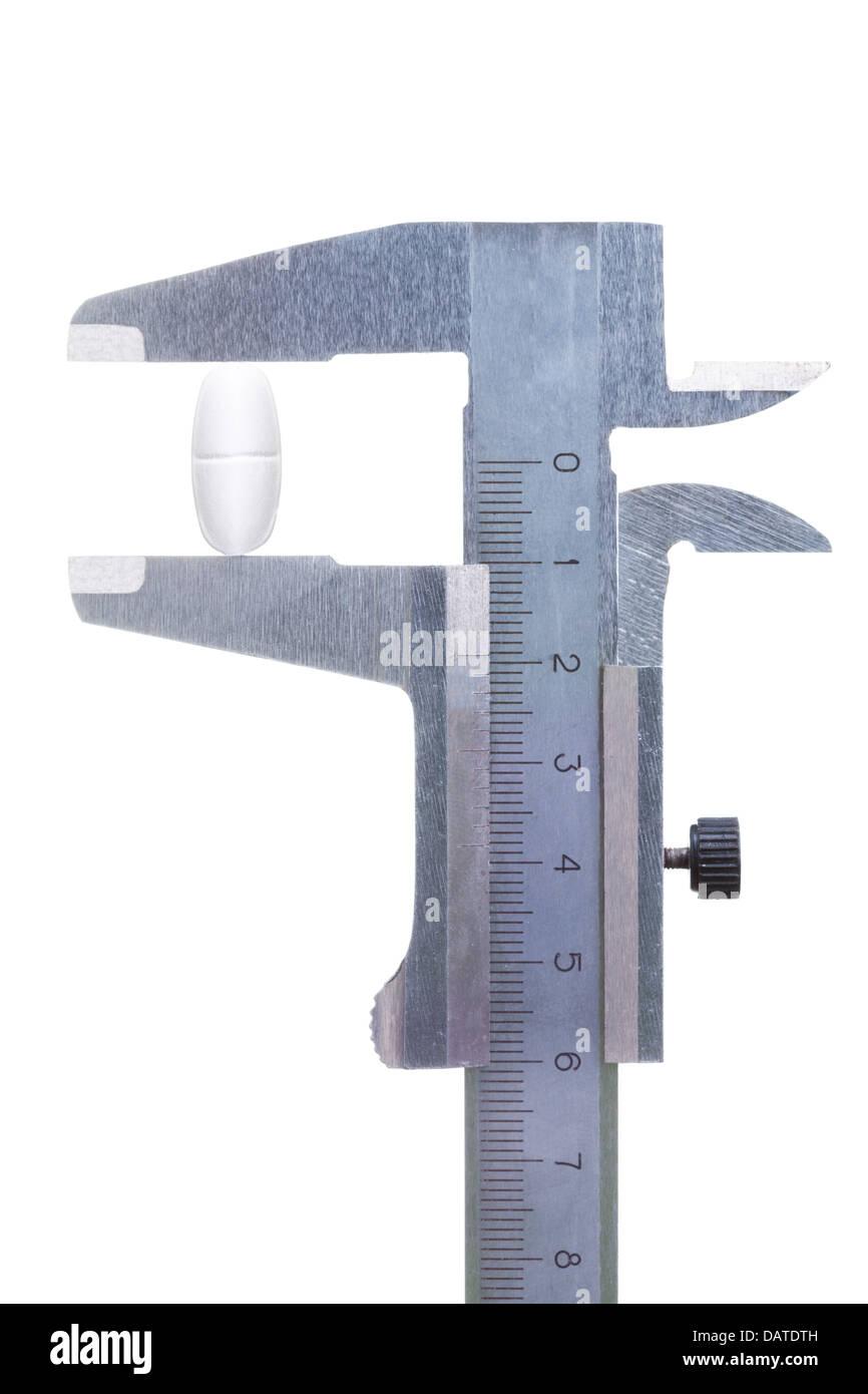 Vernier caliper measures size of white pill, isolated on white Stock ...