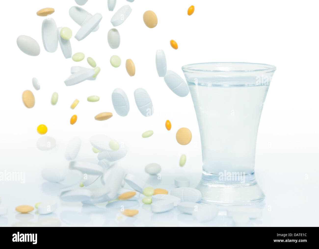 Many different drugs, pills and tablets falling on the table, with ...