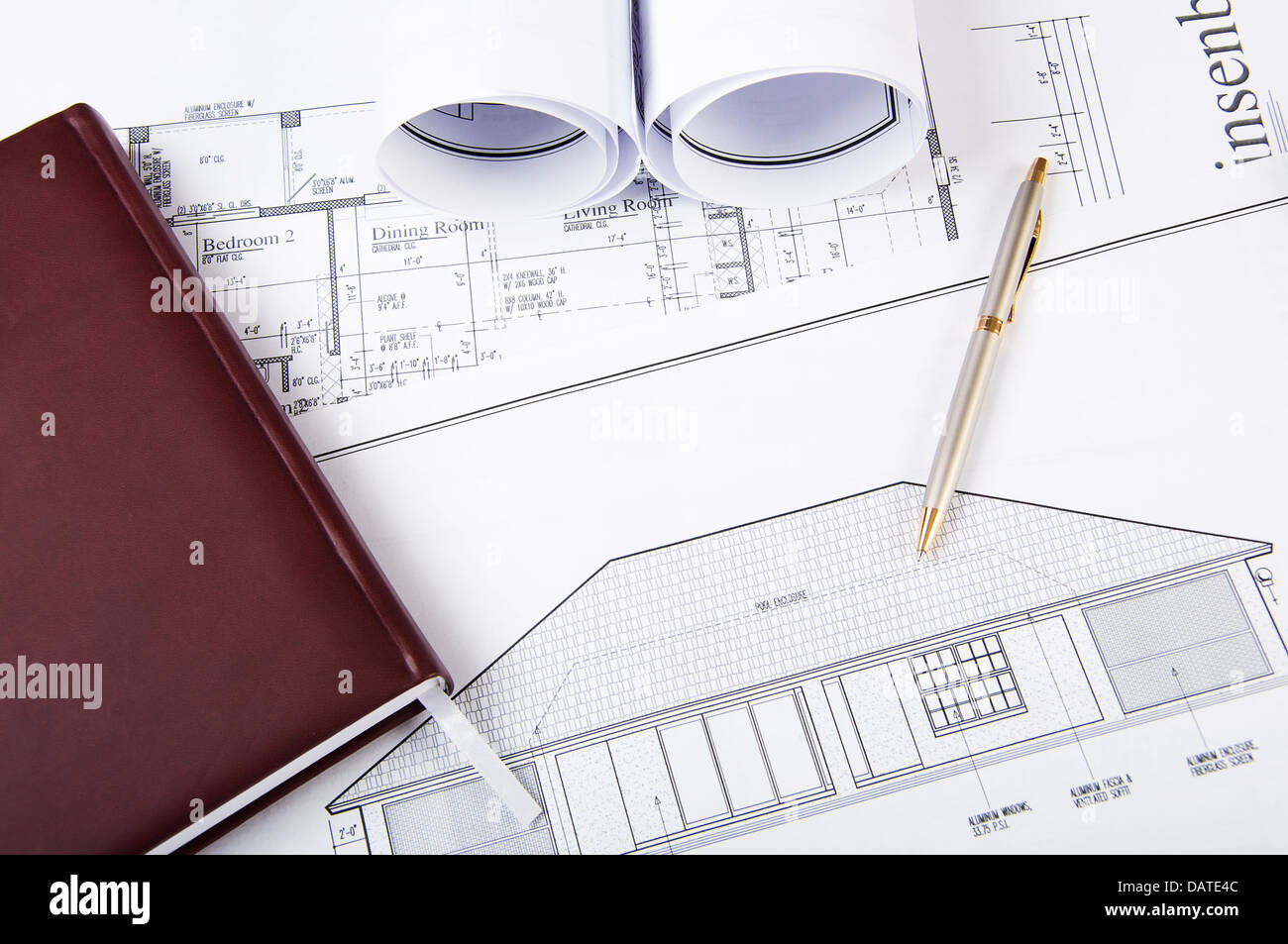 Construction plans, pen, notepad Stock Photo - Alamy