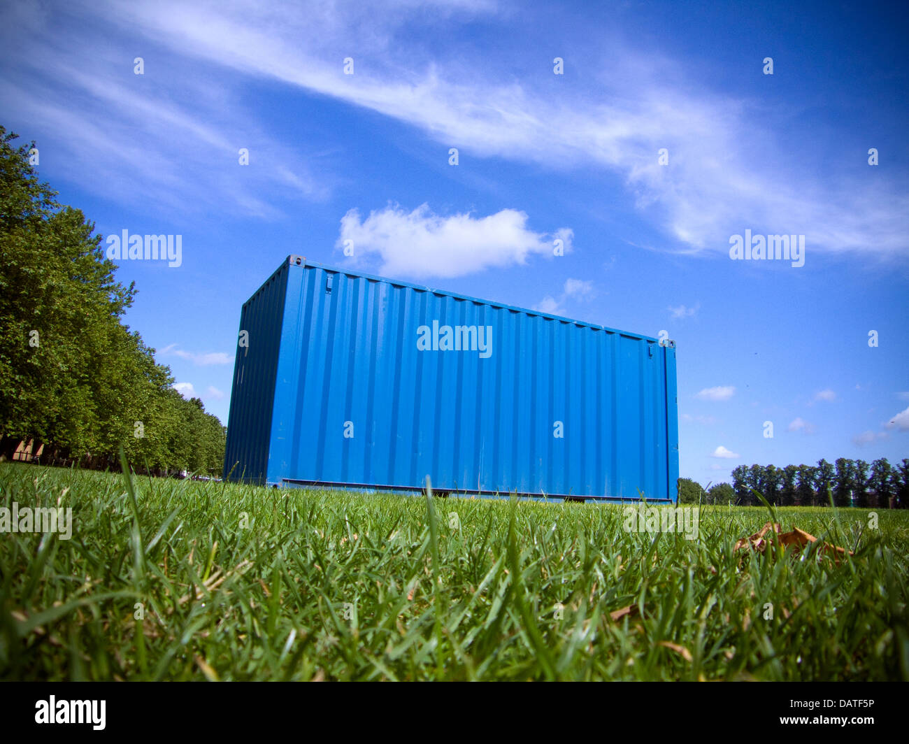 A blue transport container in a field Stock Photo - Alamy