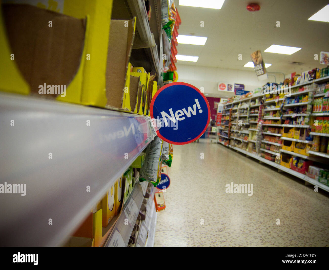 New sign on a supermarket grocery isle. Tesco, UK Stock Photo - Alamy