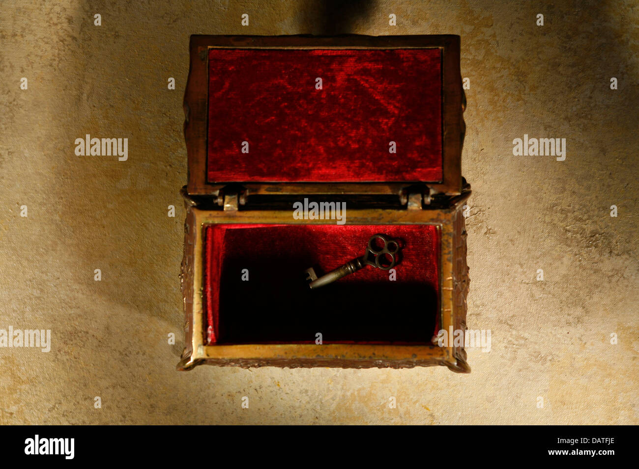 beautiful ornate wood box with silver key in it Stock Photo - Alamy