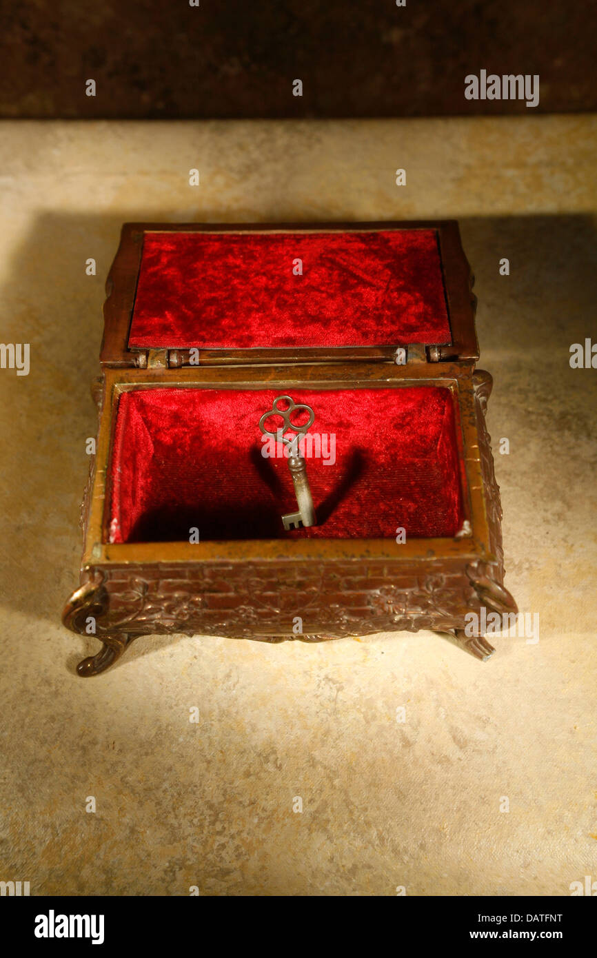 beautiful ornate wood box with silver key in it Stock Photo - Alamy