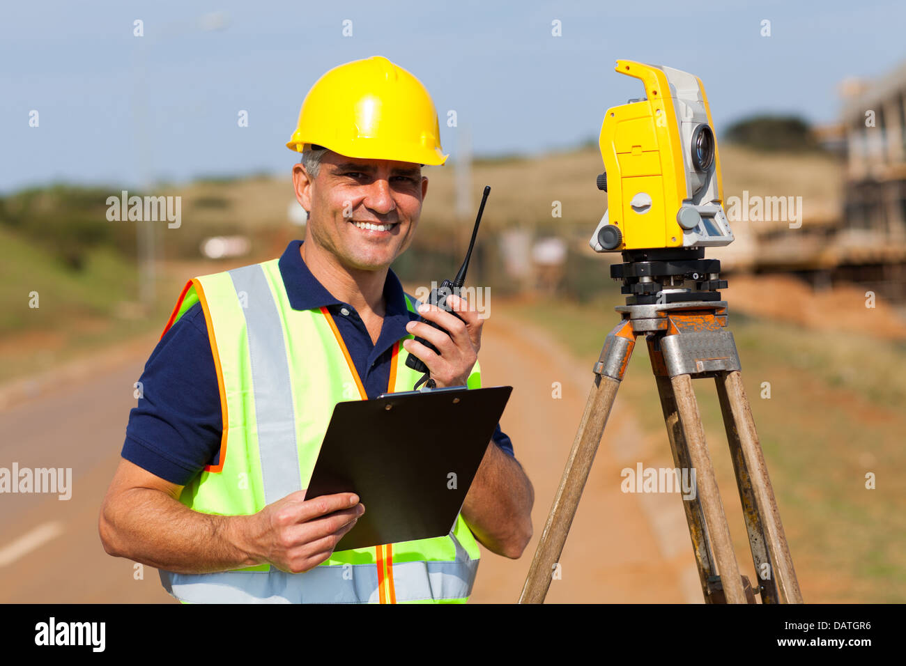 senior land surveyor working at road construction site Stock Photo - Alamy