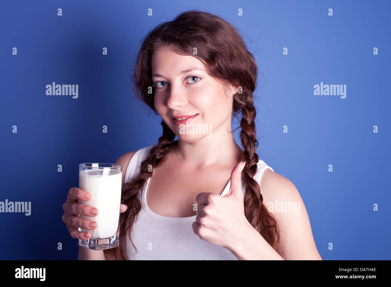 woman enjoying a glass of milk Stock Photo - Alamy