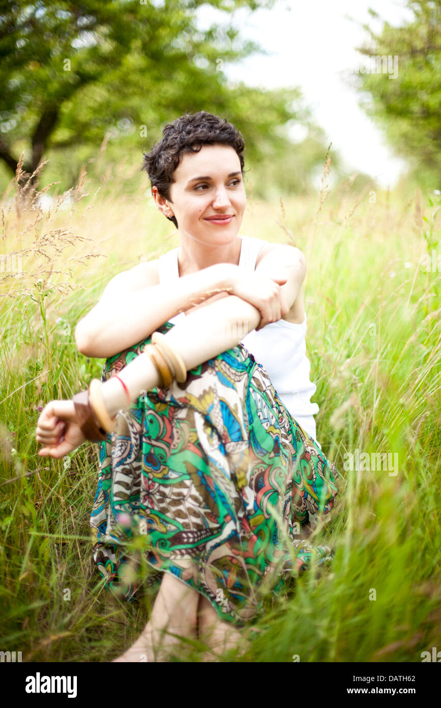 cute girl resting on fresh spring grass Stock Photo - Alamy