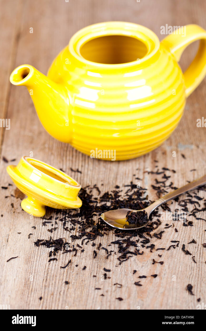 teapot with spoon and tea Stock Photo - Alamy