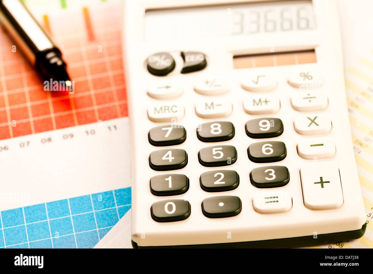 Calculator and diagram Stock Photo - Alamy