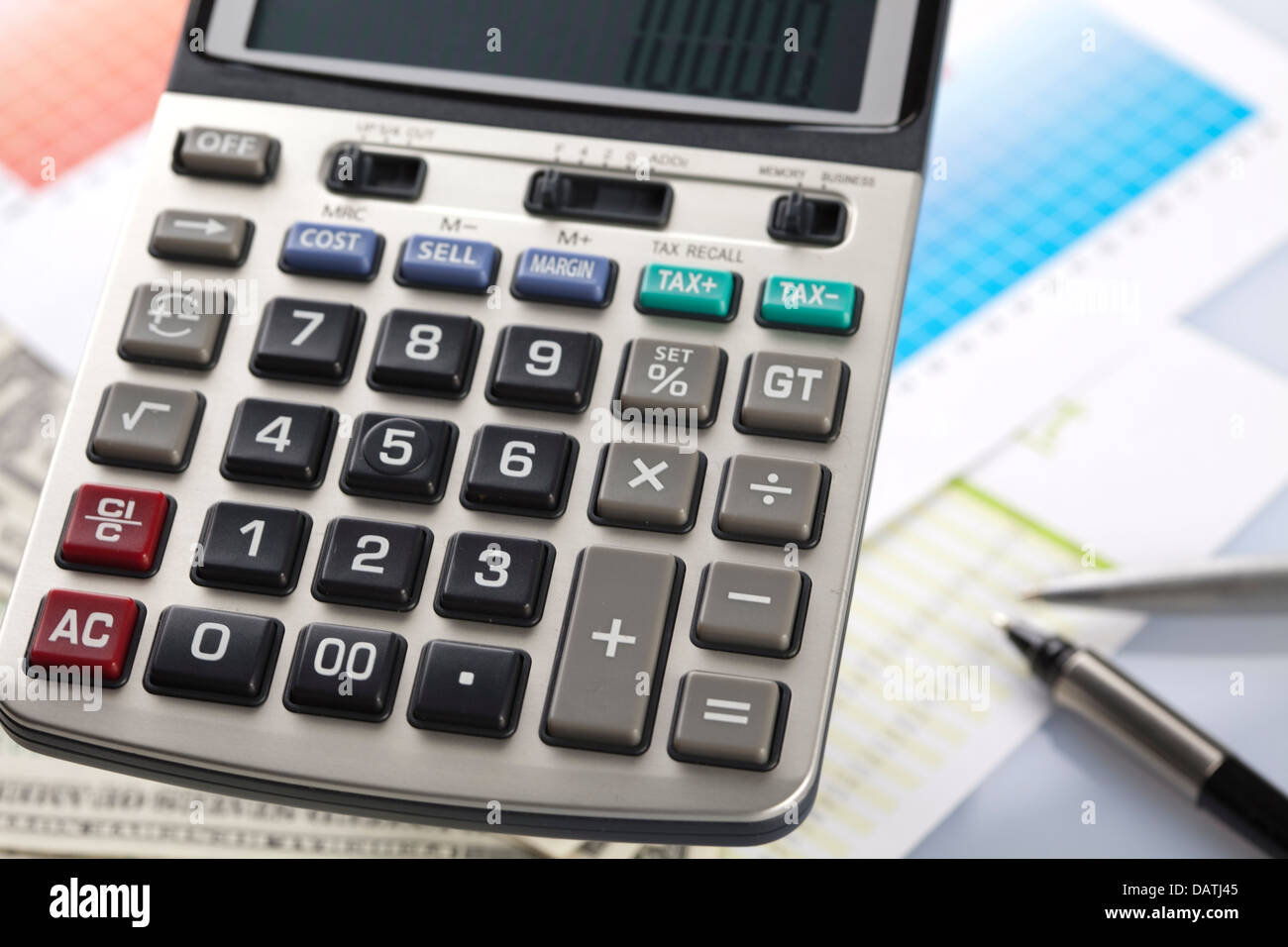 Calculator and diagram Stock Photo - Alamy