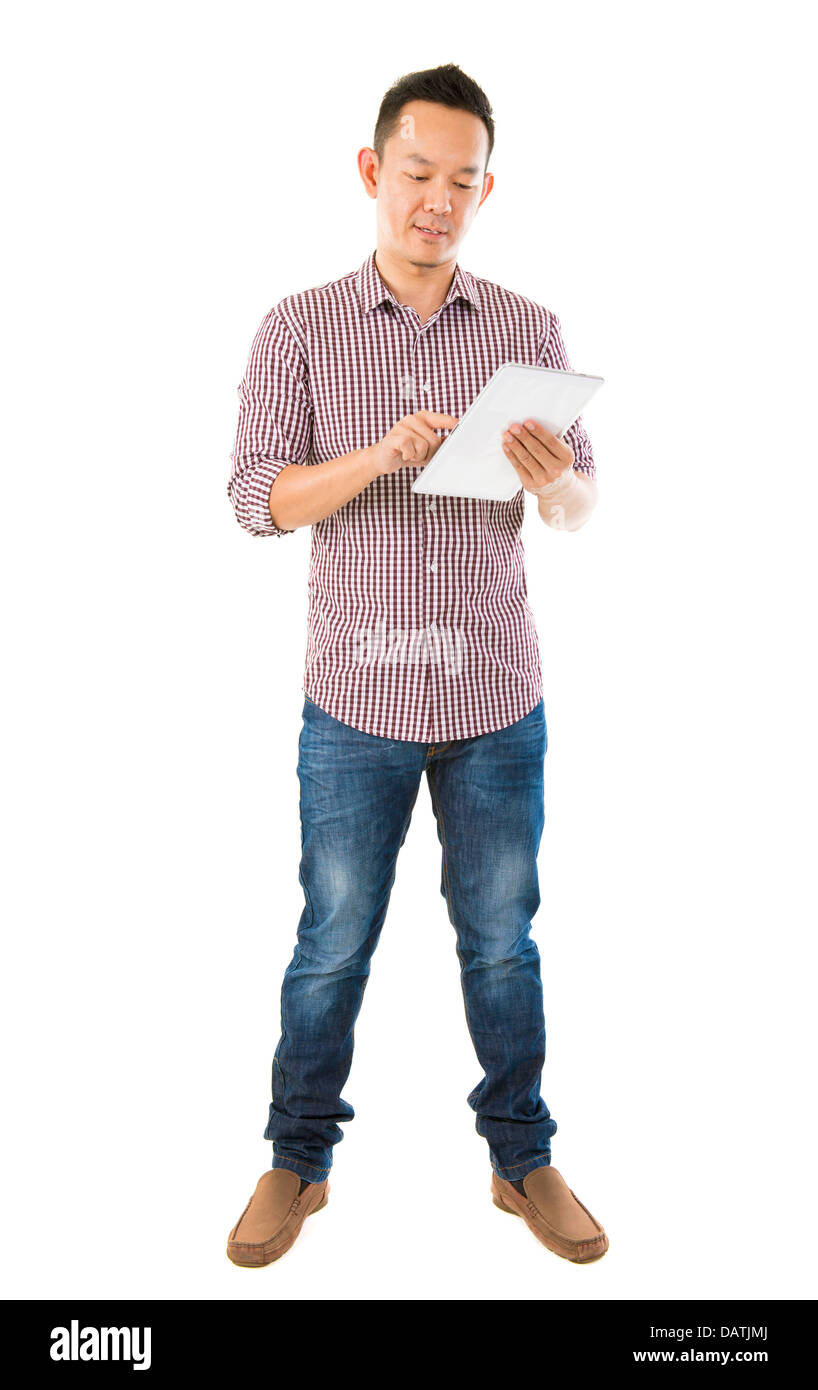 Man using tablet reading Cut Out Stock Images & Pictures - Alamy