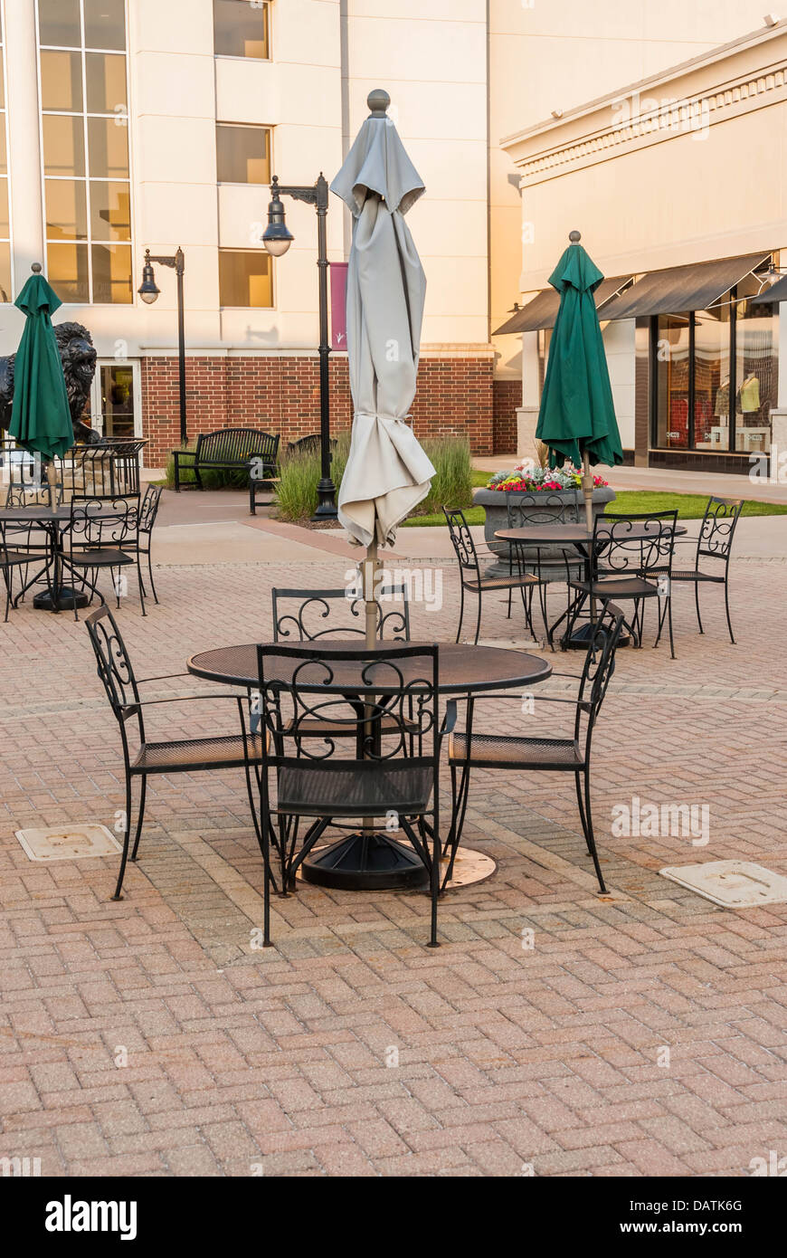Outdoors cafe with wrought iron tables for cozy feeling Stock Photo - Alamy