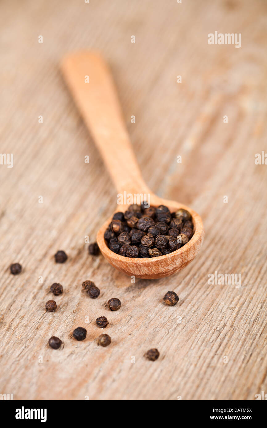 black pepper in wooden spoon Stock Photo - Alamy