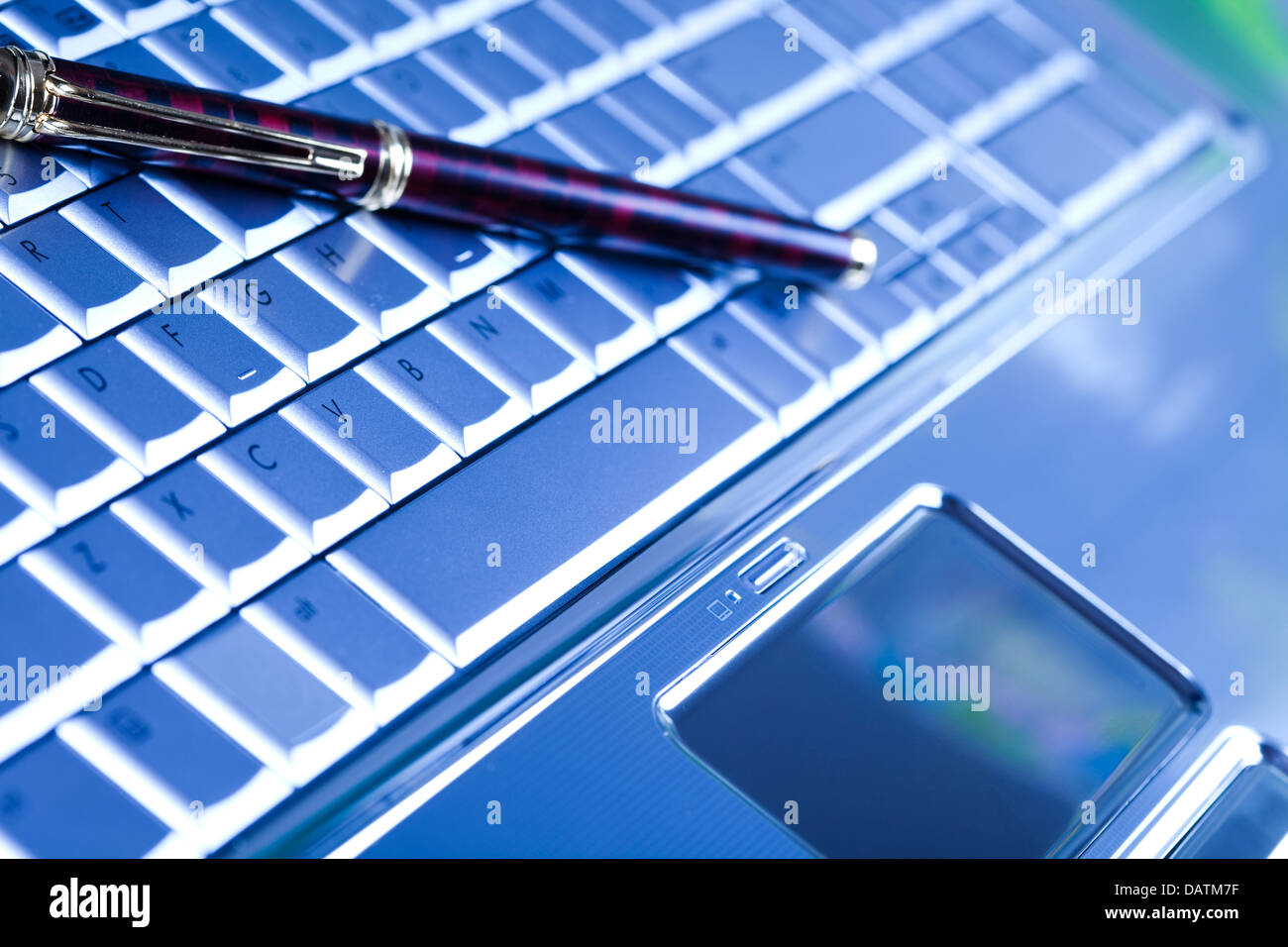 Laptop PC over background and ballpoint Stock Photo - Alamy