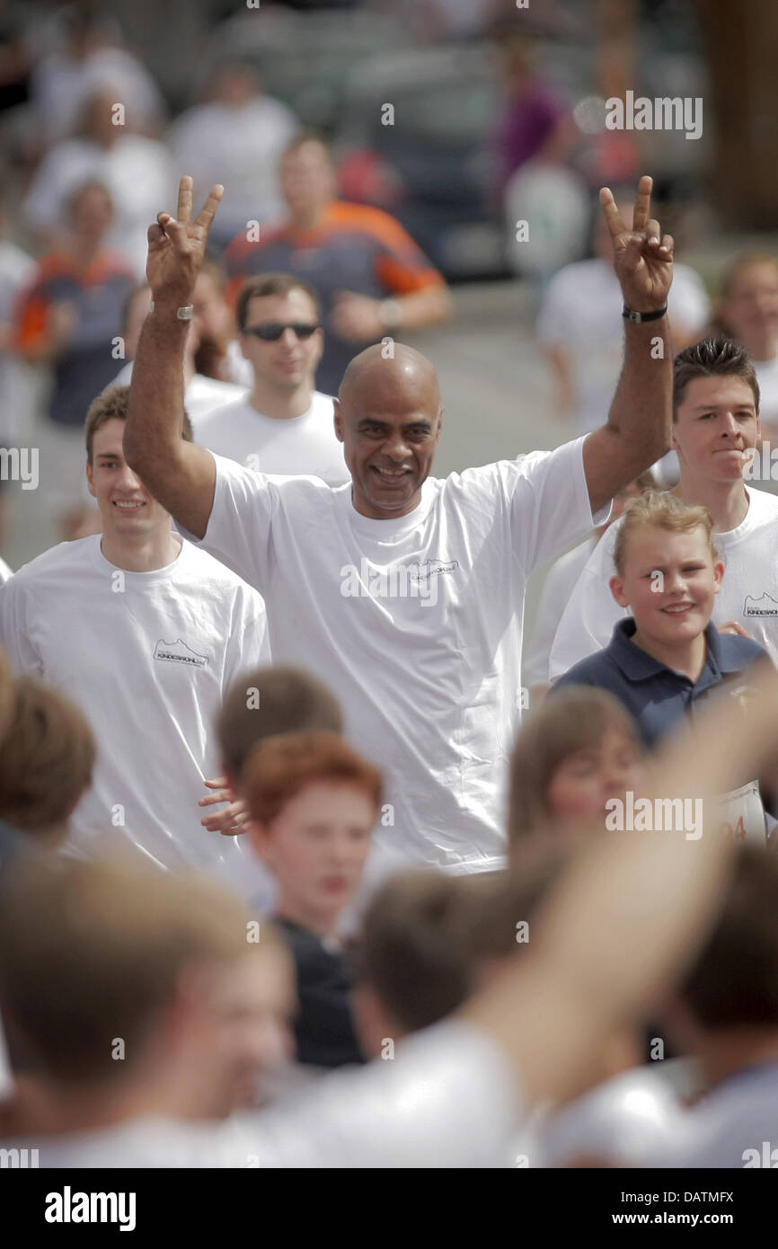 Actor and politician Charles M. Huber (C) takes part in a benefit walk ...