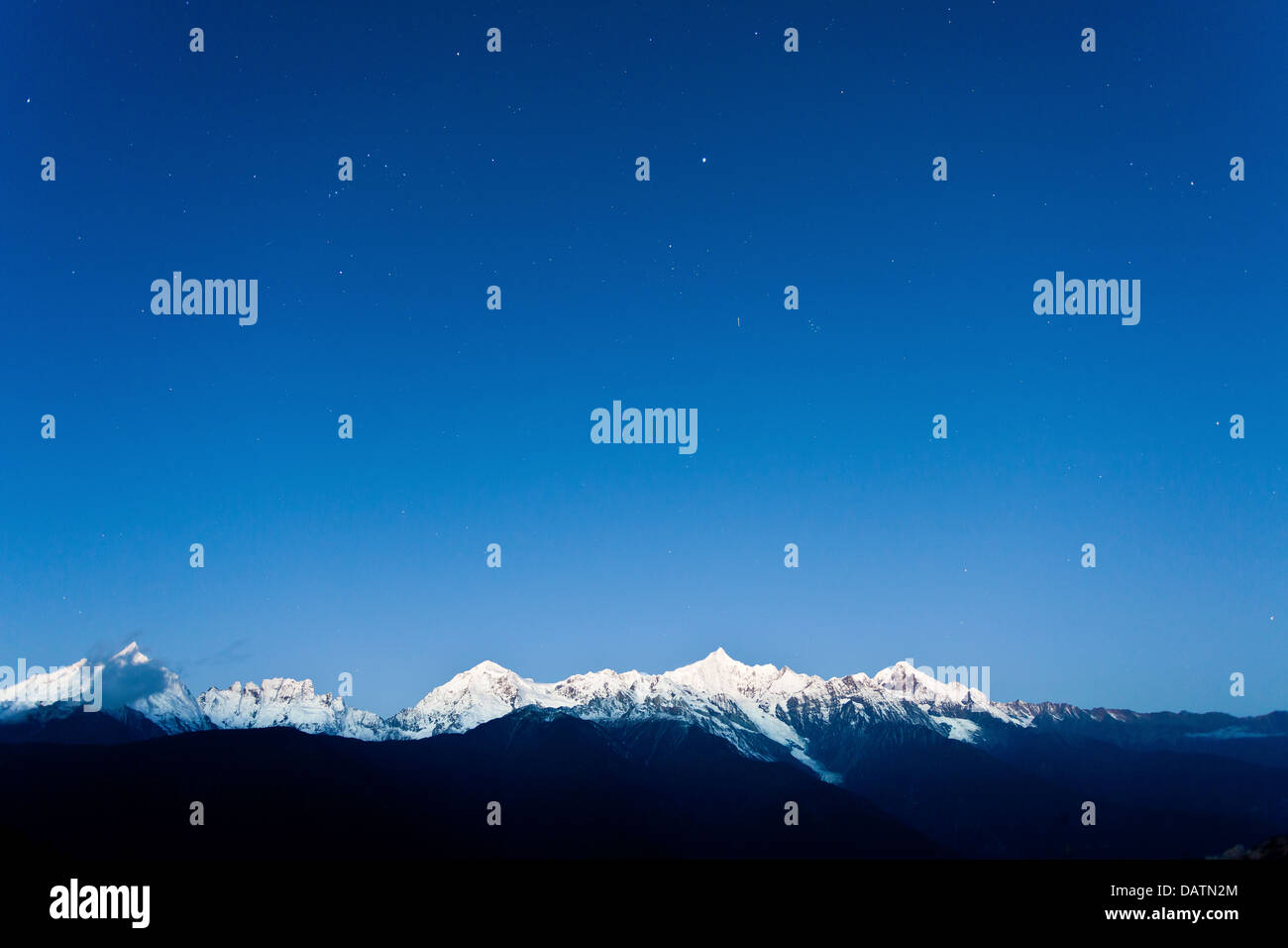 Snow mountain at dawn with stars Stock Photo - Alamy