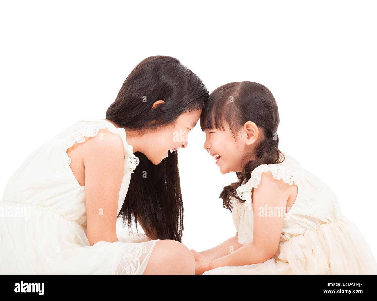 happy two little girls looking each other Stock Photo - Alamy