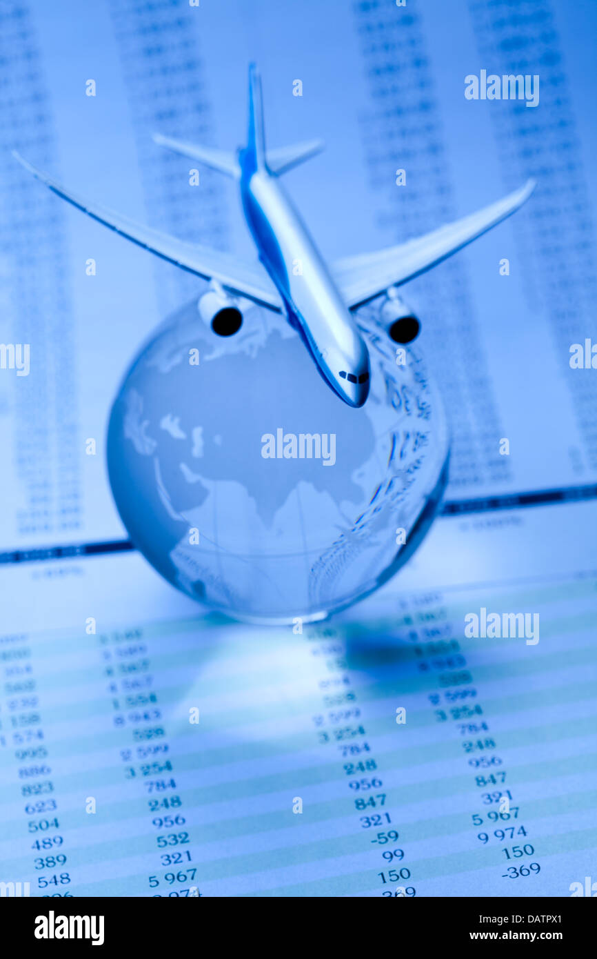 Airplane in finance and world Stock Photo - Alamy