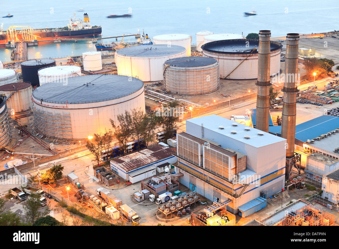 Oil tanks at night Stock Photo - Alamy