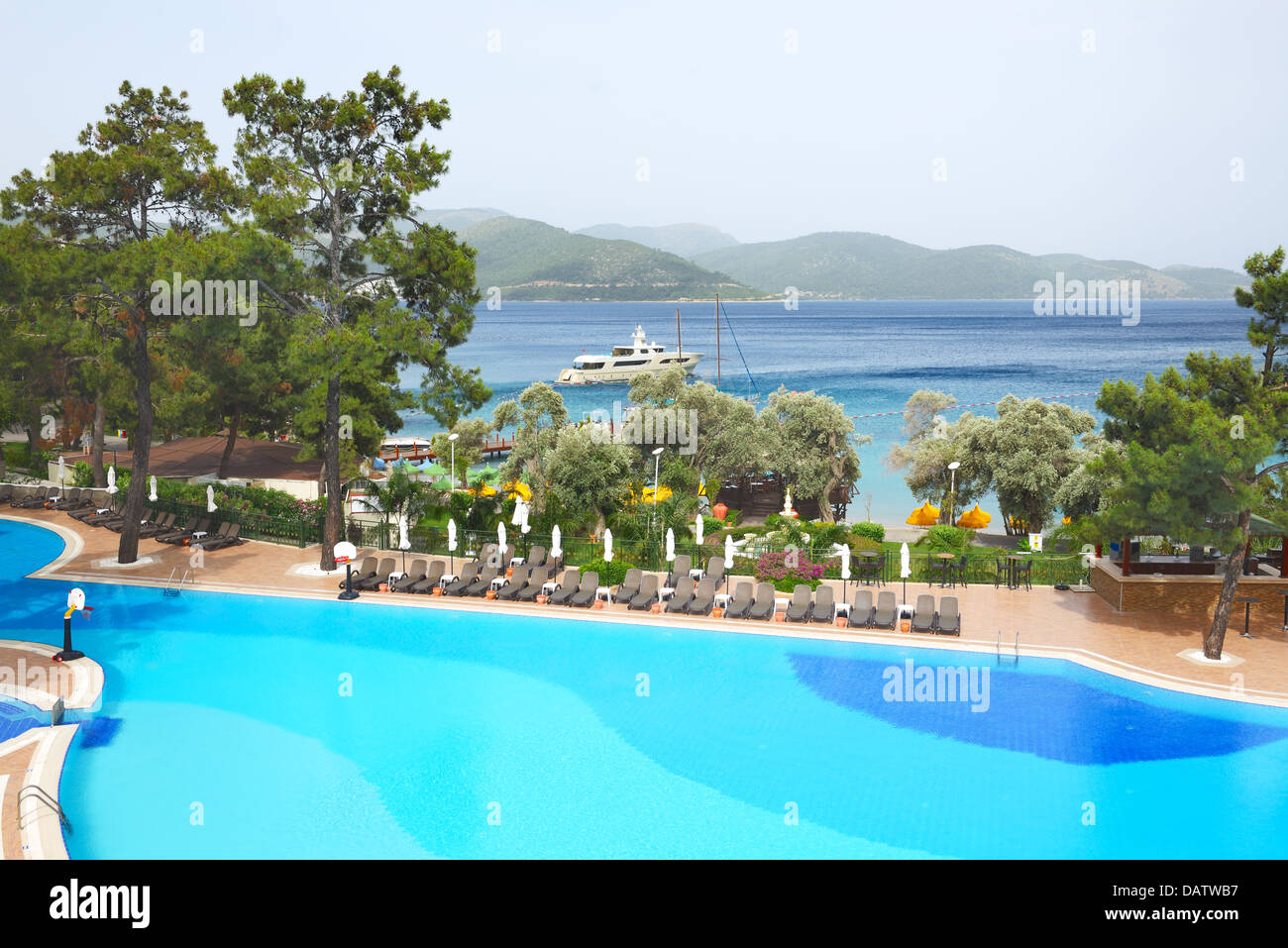Swimming pool and yacht at the pier on Mediterranean turkish resort ...