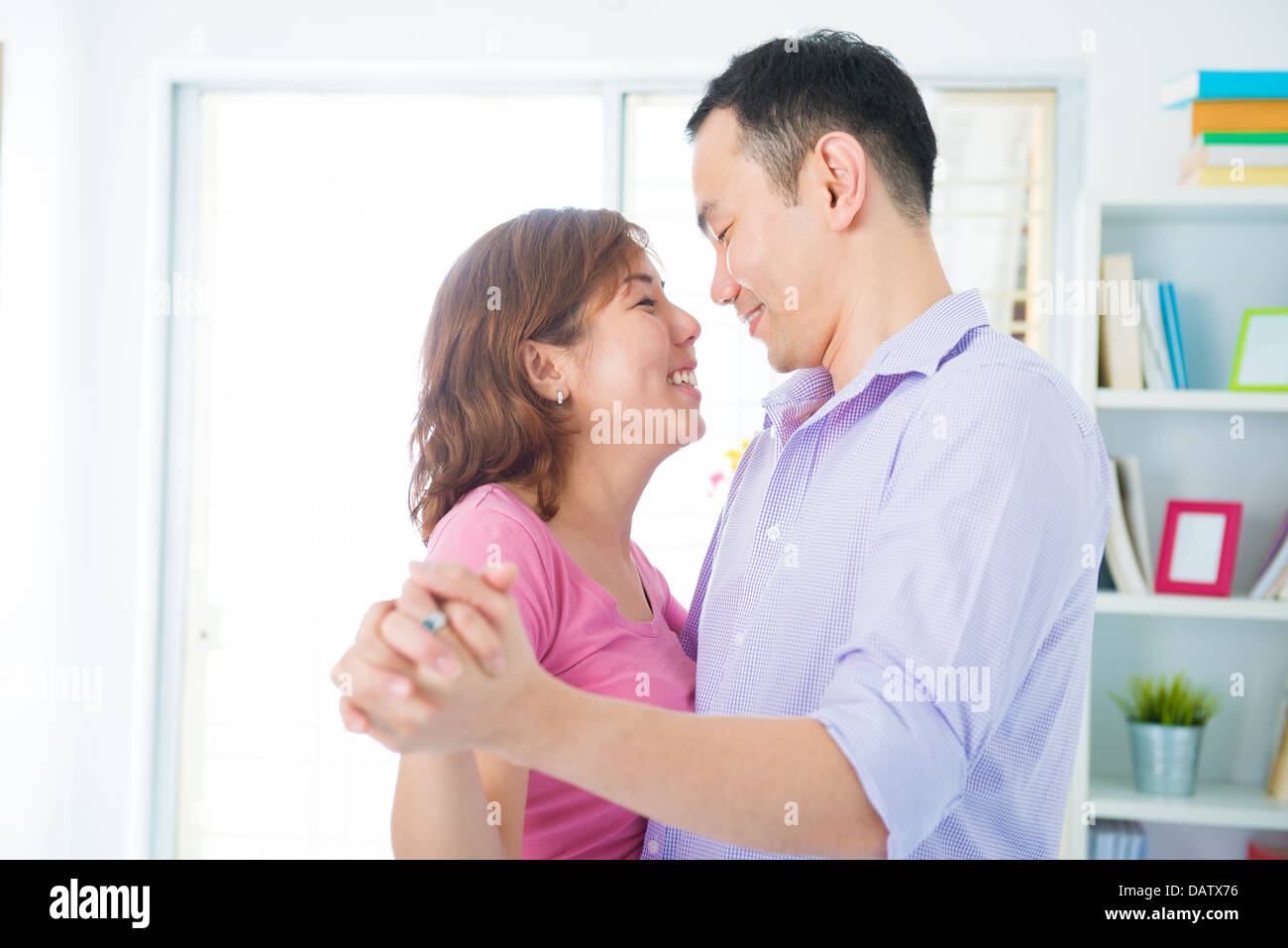 Fun couple dancing Stock Photo - Alamy