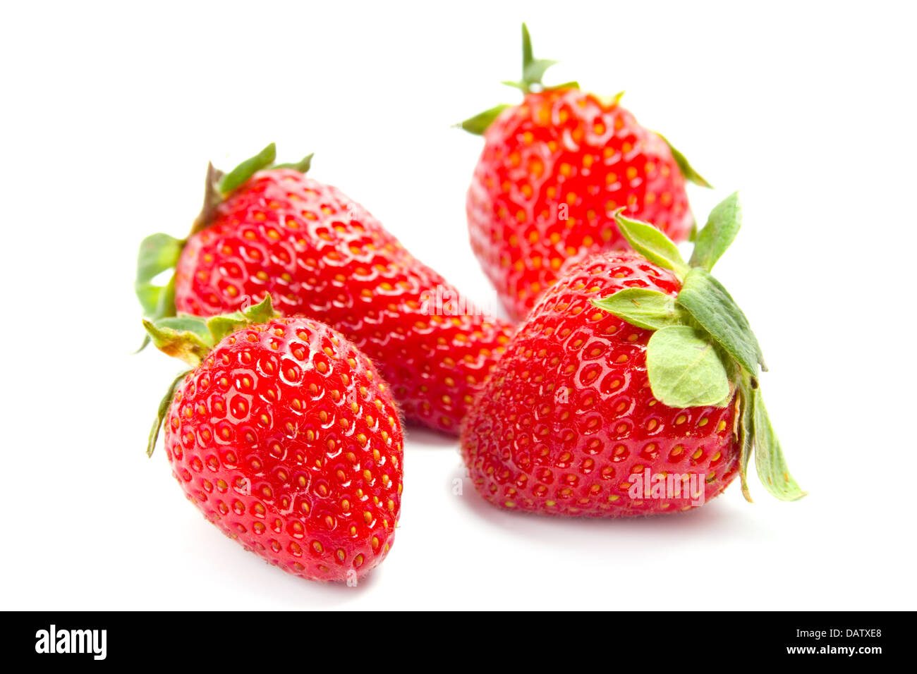 four fresh strawberries Stock Photo - Alamy