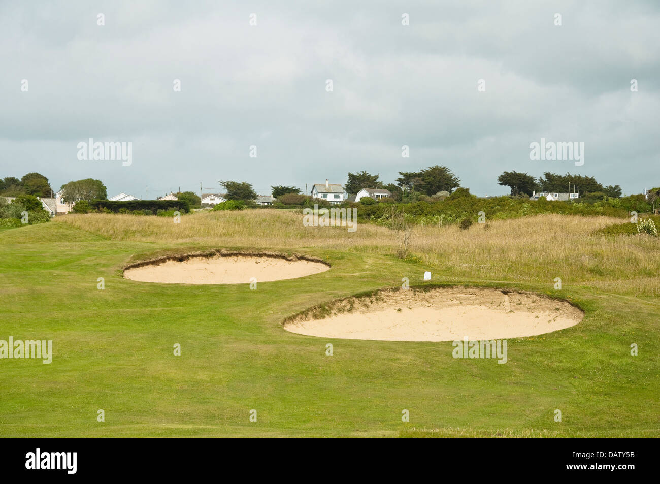 Two Bunkers at St Enodoc Golf Club, Cornwall, with houses on the ...