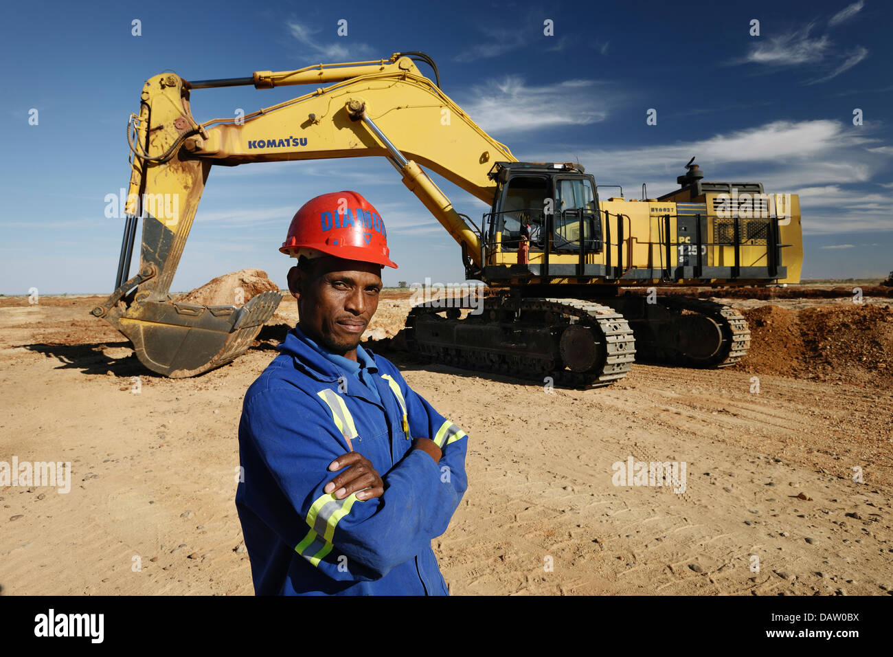 Komatsu driver with diamond mining equipment,excavating top soil near ...