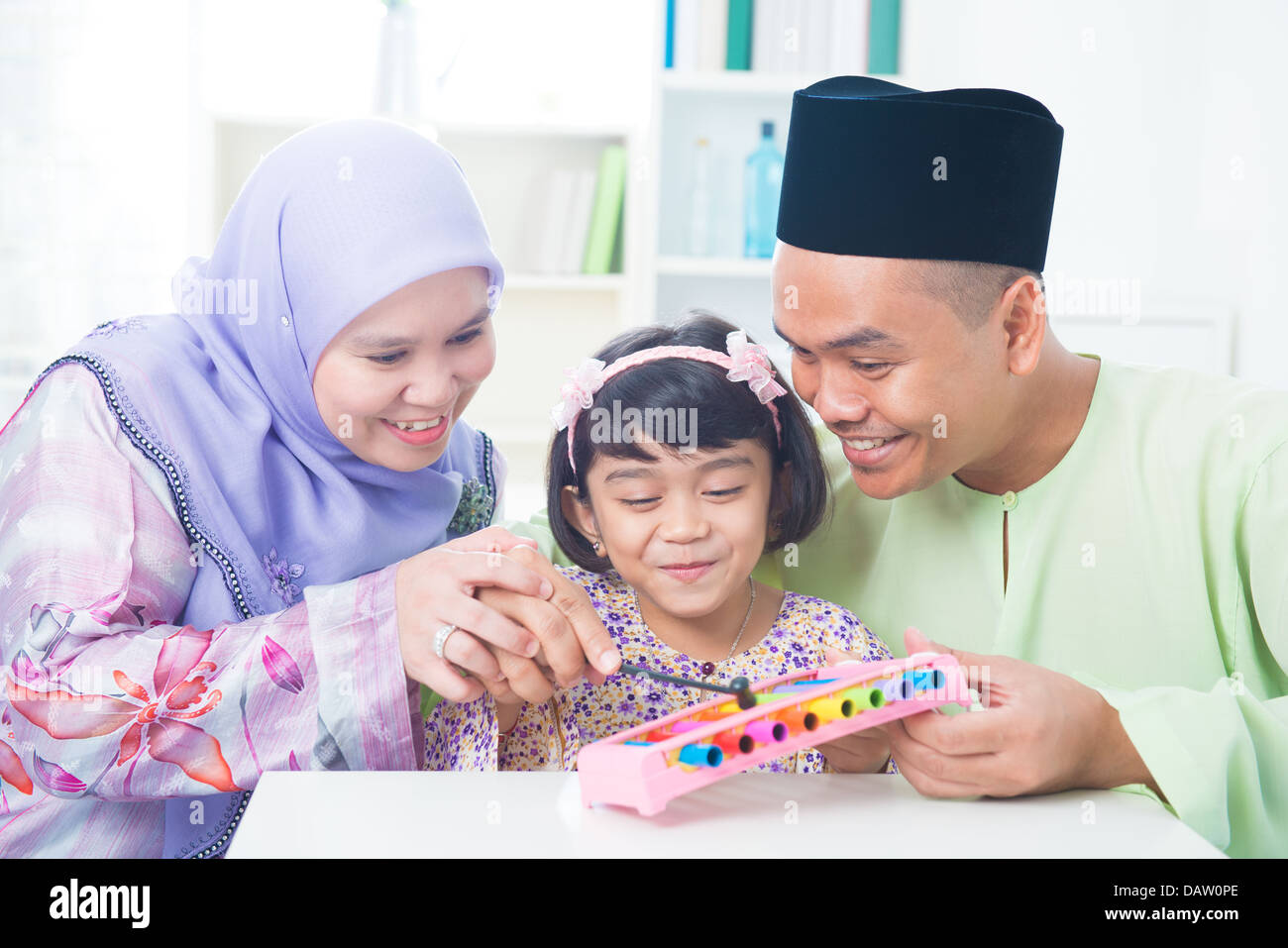 Child playing music asia hi-res stock photography and images - Alamy