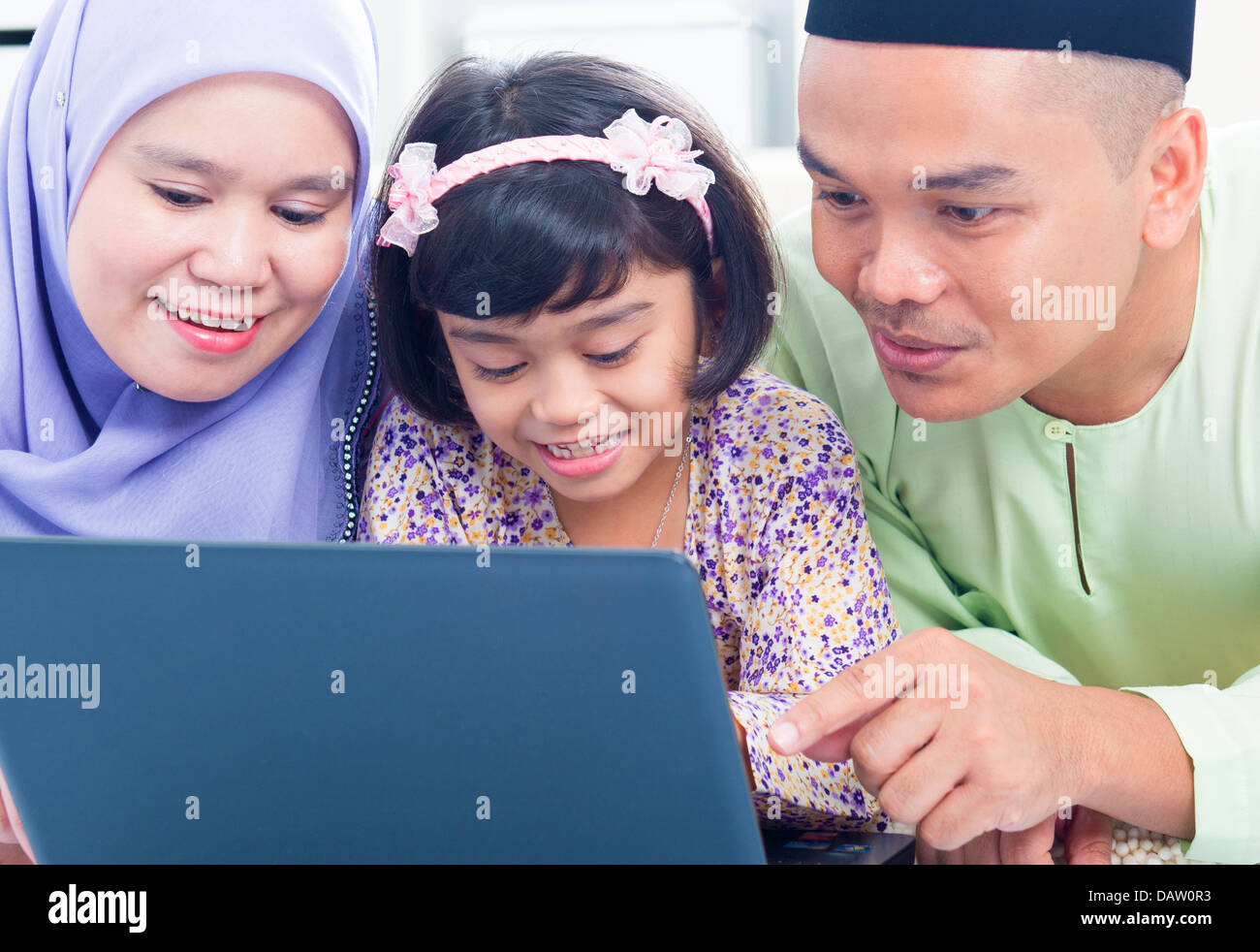 Asian family browsing internet Stock Photo - Alamy