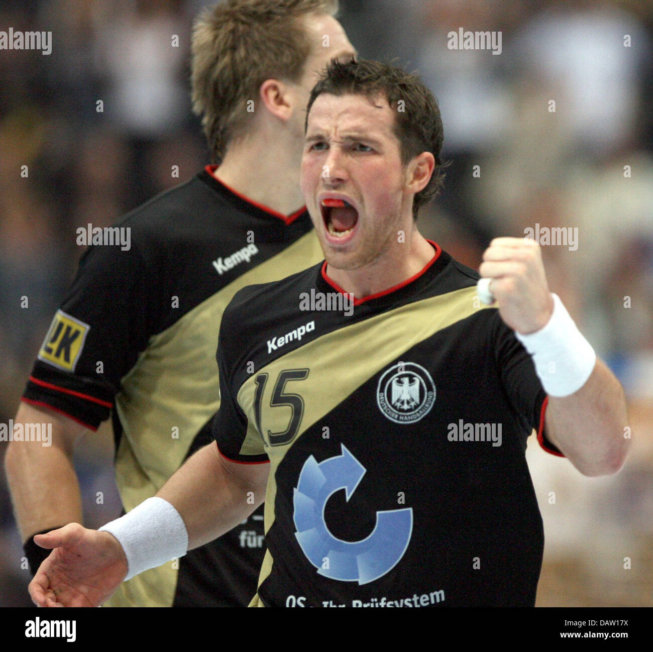 Germany's Torsten Jansen cheers after scoring during the 2007 Handball ...
