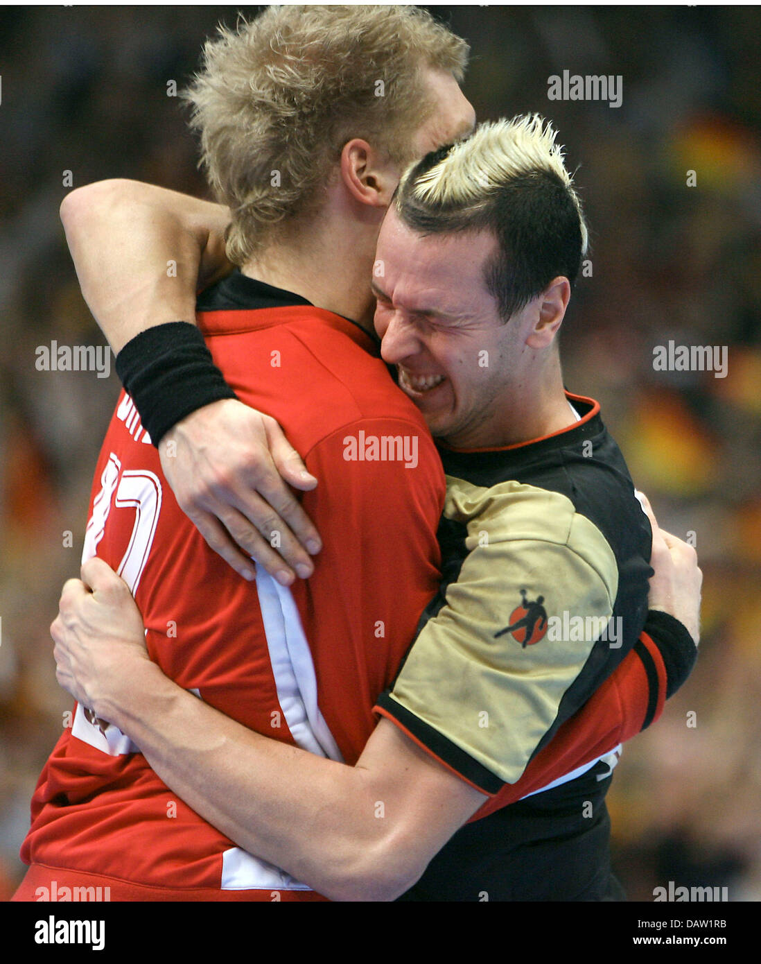 German national handball team player Pascal Hens hugs goalkeeper ...