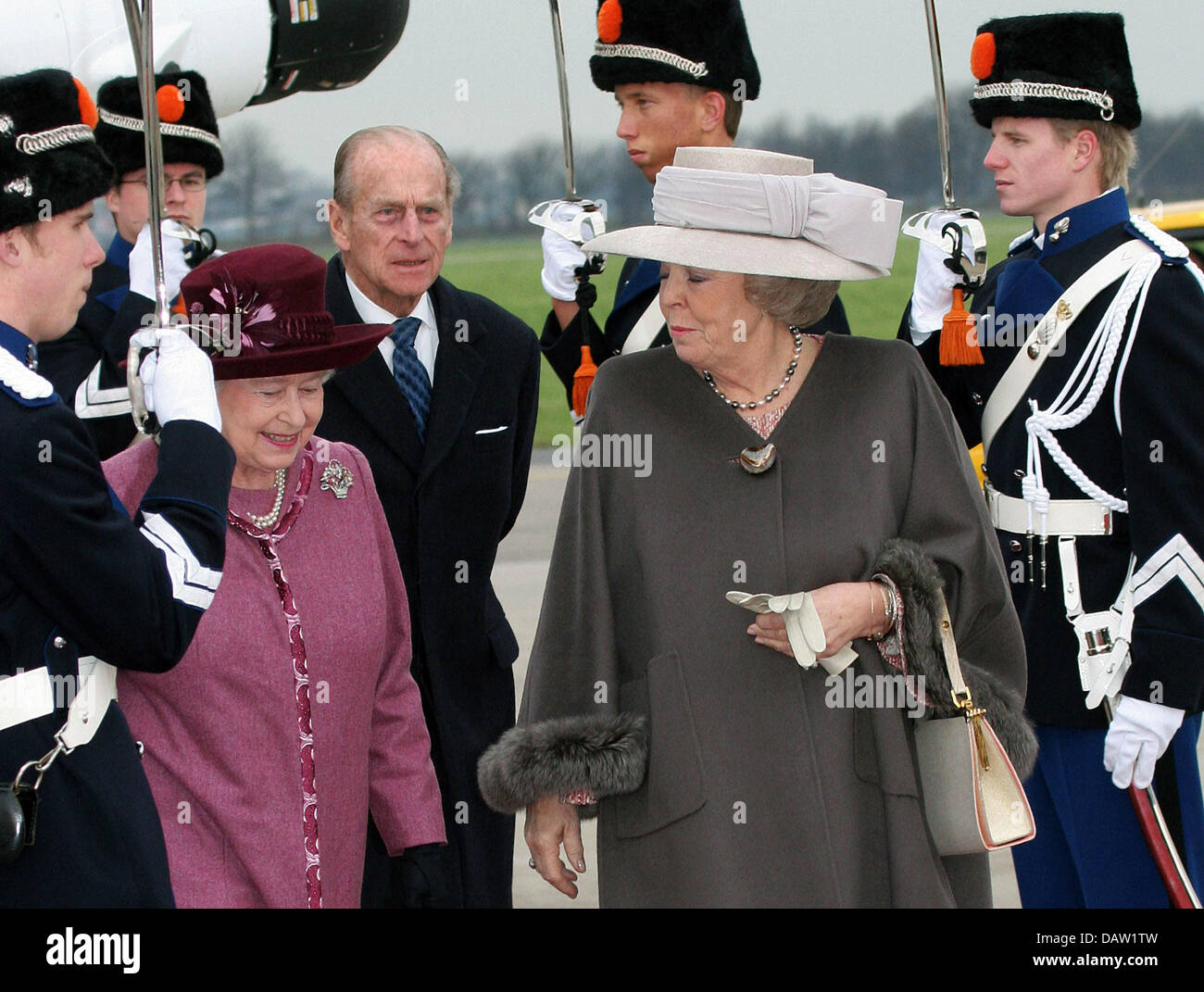 Britain's Queen Elizabeth II (L) and the Duke of Edinburgh are welcomed ...