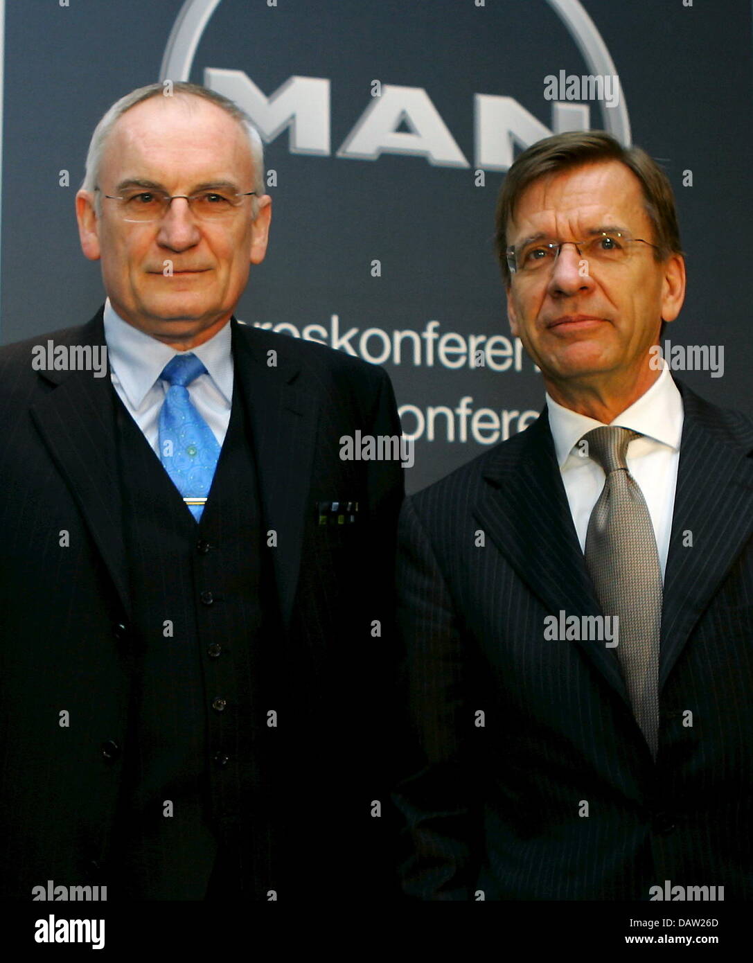 Hakan Samuelsson (R), CEO of MAN, and CFO Karlheinz Hornung (L) smile ...