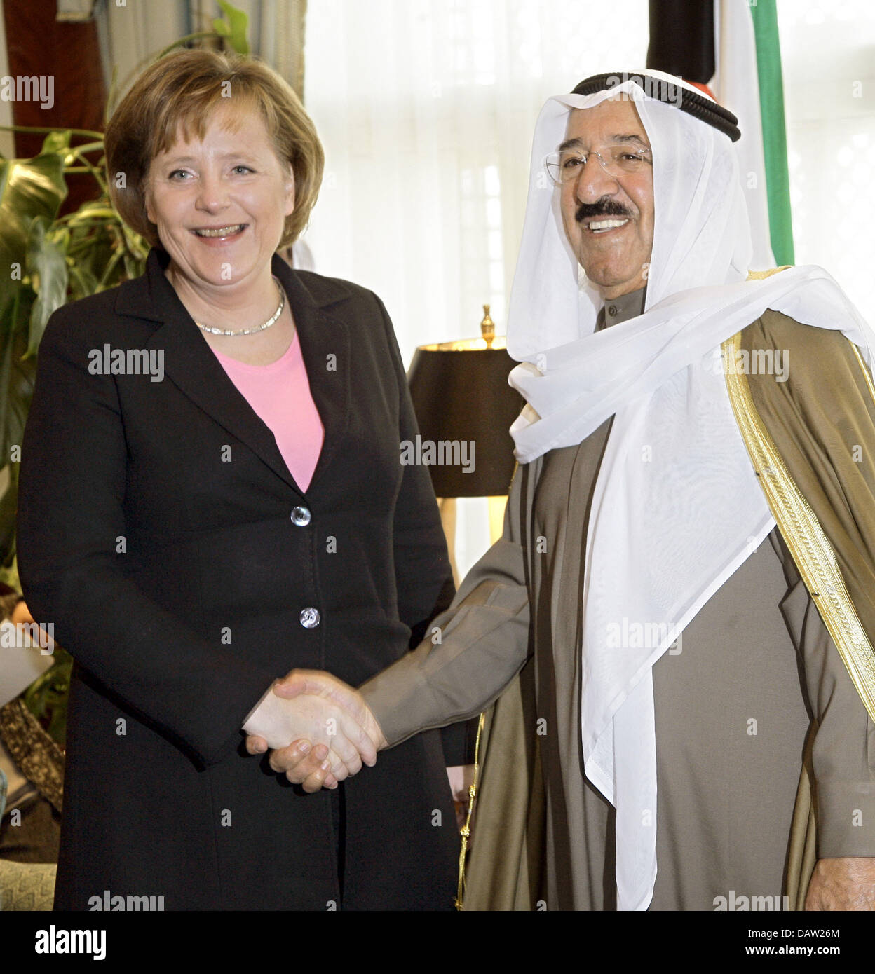 German Chancellor Angela Merkel (L) is welcomed by Amir of Kuwait HH ...
