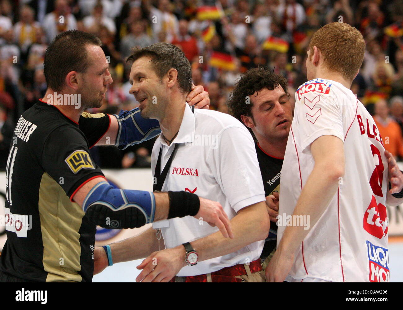 German and Polish players hug after Germany wins the 2007 Germany ...
