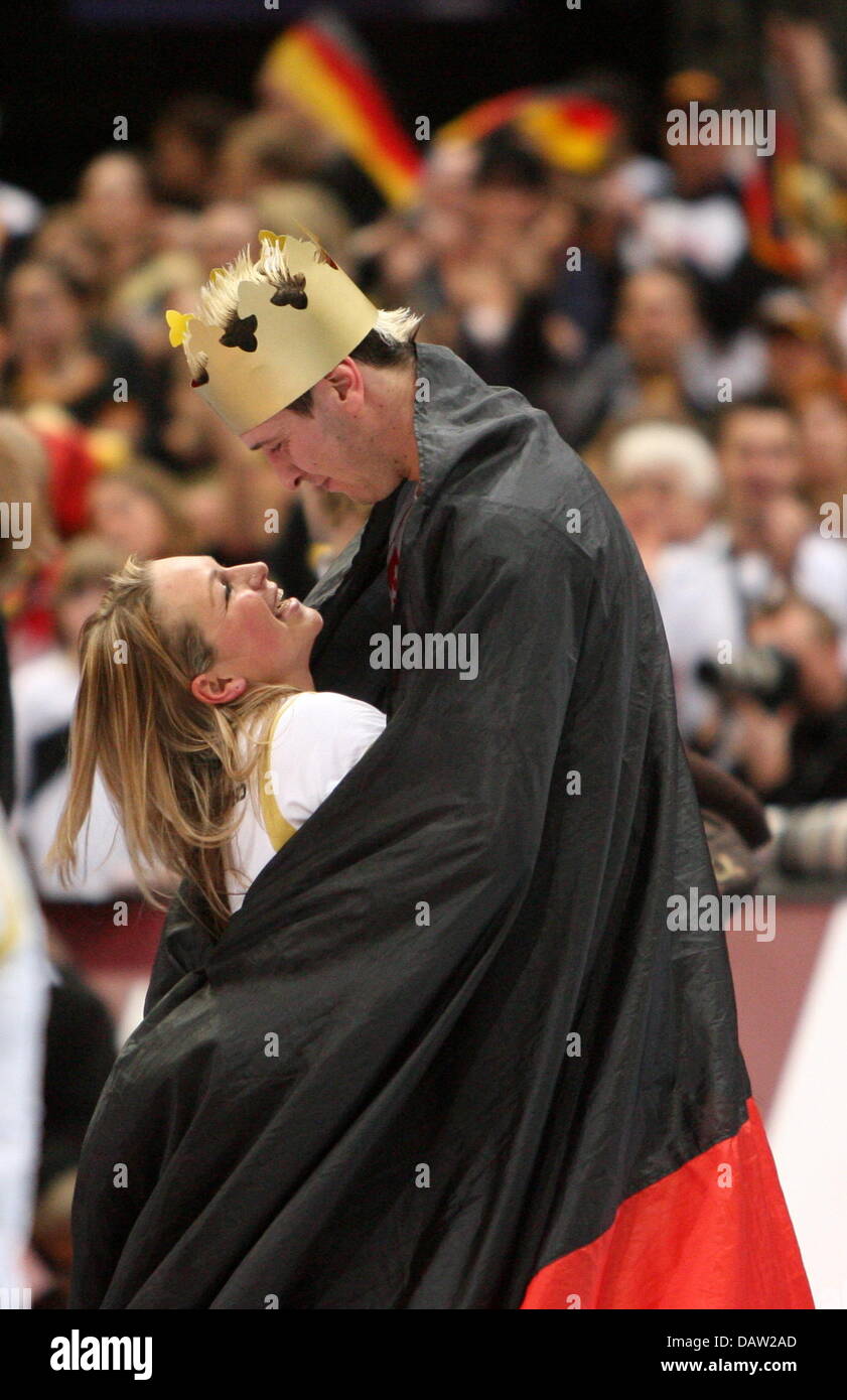 German international Pascal Hens hugs his girlfriend after winning the ...