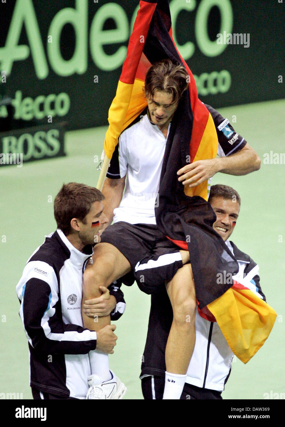 German tennis pro Thomas (Tommy) Haas (top) celebrates his victory ...