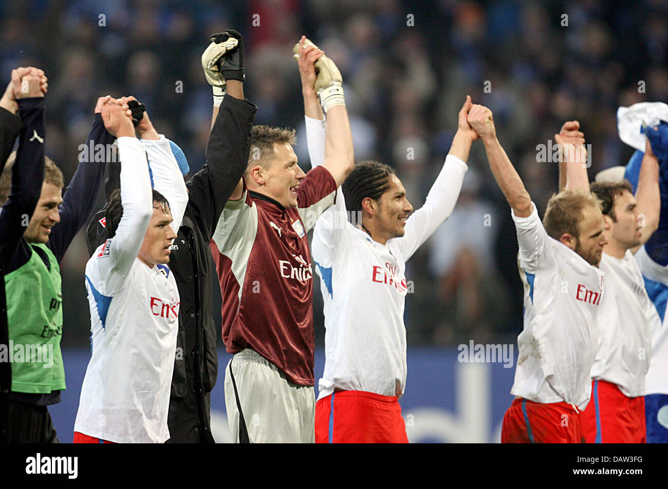 Hamburg's players with goalkeeper Frank Rost at their centre celebrate ...