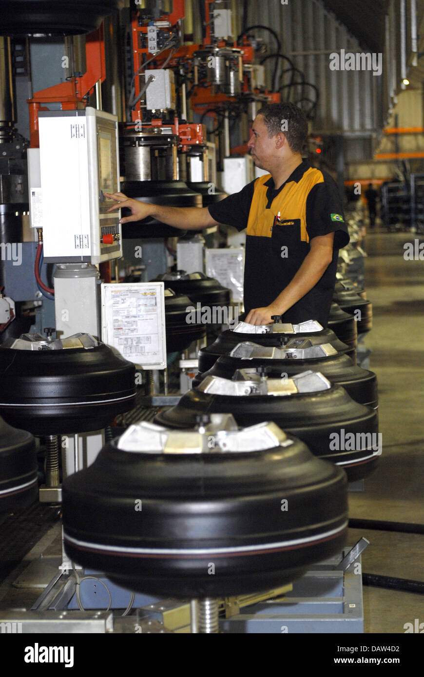 (dpa file) An employee of Continental Brazil pictured during the tyre ...