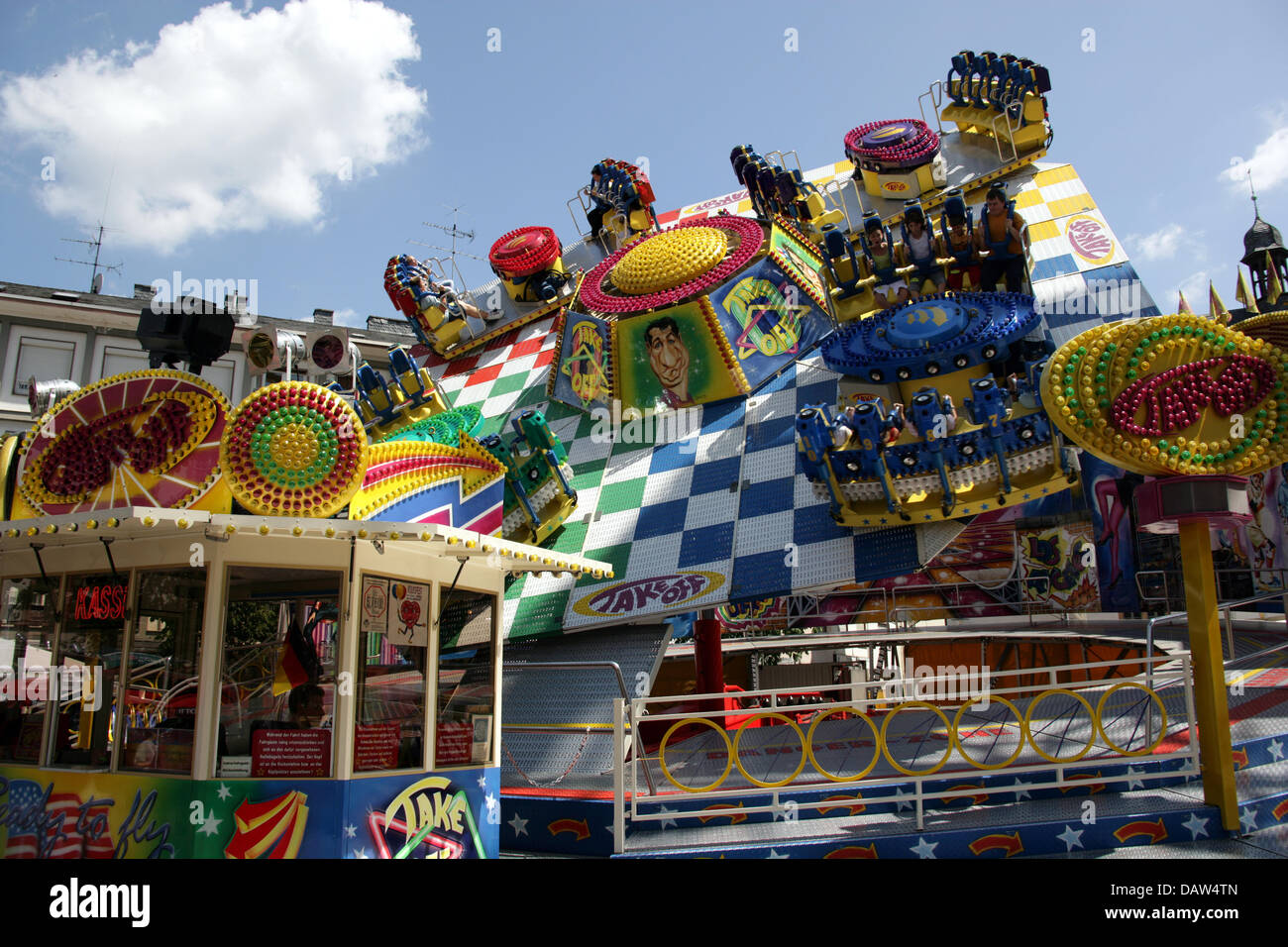 Visitors of the Heinerfest (festival) ride the roundabout 'Take Off' in ...